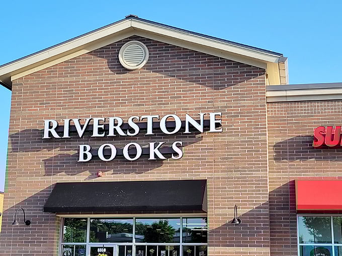 The brick façade of Riverstone Books stands like a literary lighthouse, beckoning bibliophiles with its simple, elegant signage against the blue Pittsburgh sky. 