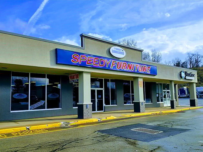 The blue and red storefront beckons like a furniture oasis in the strip mall desert. No pretension, just promises of comfortable living ahead.