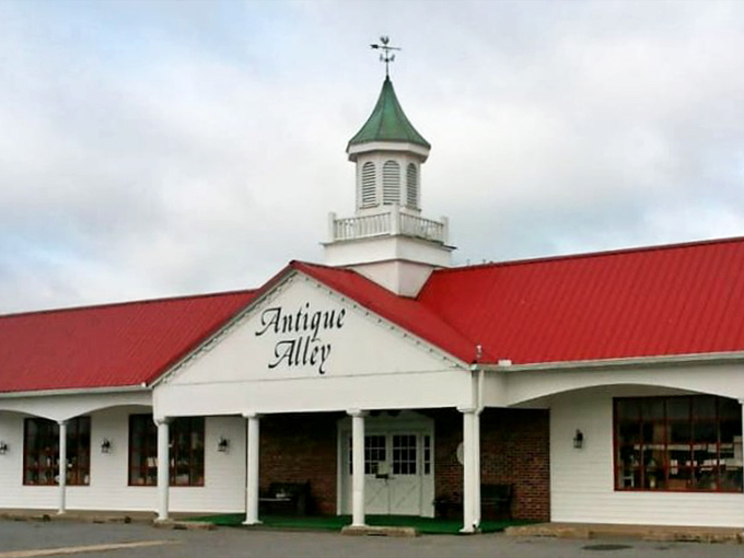 The church-like cupola and bright red roof make Antique Alley impossible to miss—like a cathedral where the religion is vintage treasures and bargain hunting.