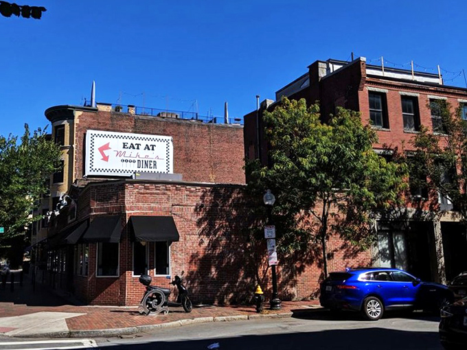 The brick façade of Mike's City Diner stands like a beacon of breakfast hope on Washington Street, promising culinary salvation to hungry Bostonians.