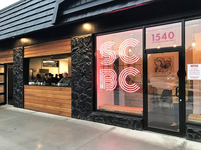 The neon glow of SCBC beckons breakfast enthusiasts like a pink lighthouse guiding hungry sailors to shore. Modern meets cozy in this distinctive Omaha storefront.