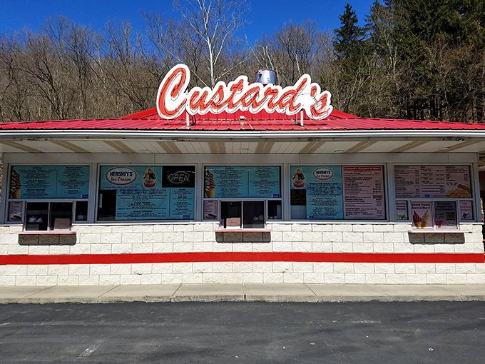 The neon glow of Custard's against a twilight sky isn't just signage—it's a beacon of hope for dessert lovers seeking frozen nirvana.