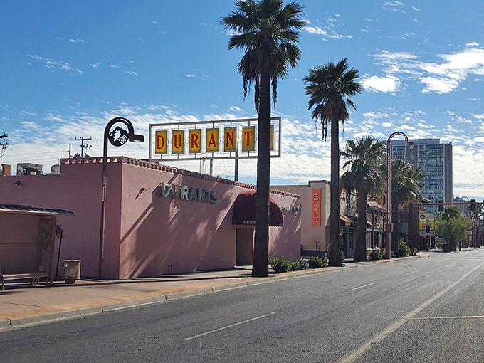 The iconic pink exterior of Durant's stands proudly on Central Avenue, a mid-century mirage in downtown Phoenix's urban landscape.