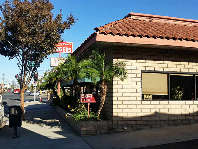 The red-tiled roof and brick facade of Old Time Drive In stands as a beacon of comfort food in Sun Valley, where California sunshine meets classic American dining.