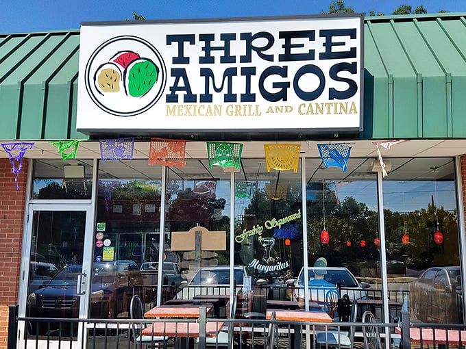 The vibrant mural outside Three Amigos sets the tone – authentic Mexican cuisine lives behind this unassuming brick façade in Charlotte.