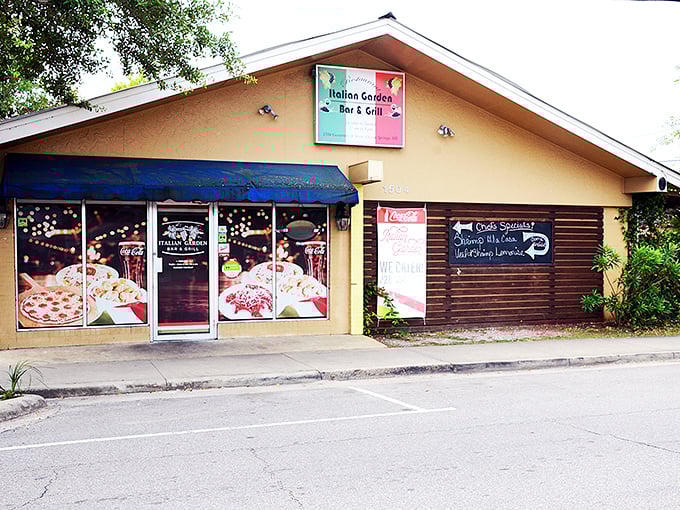 The welcoming facade of Italian Garden beckons hungry travelers with its cheerful signage and cozy entrance. A hidden gem waiting to be discovered.