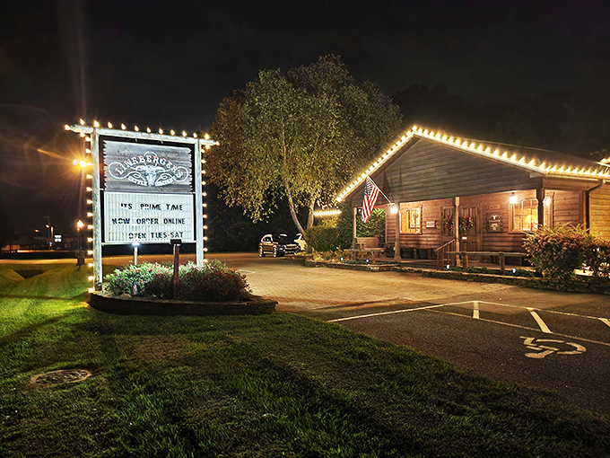Rustic charm meets carnivore's paradise at this unassuming wooden cabin. The brick pathway practically whispers, "Follow me to steak nirvana."