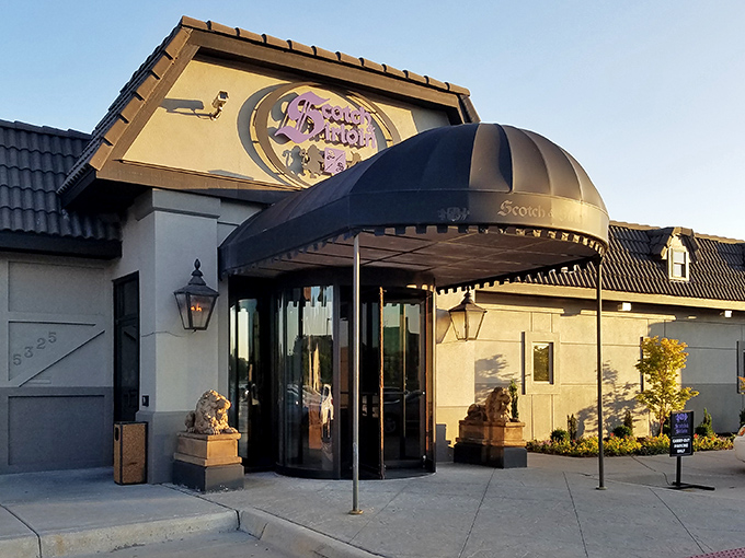 The iconic entrance to Scotch & Sirloin, where those stone lions aren't just guarding the door—they're keeping the vegetarians at bay.