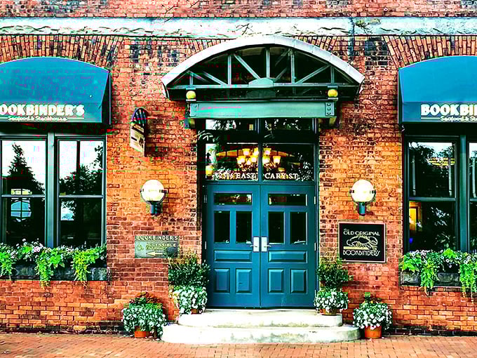 The historic brick façade of Bookbinder's welcomes you with teal awnings and warm globe lights—Richmond's culinary time machine disguised as a restaurant. 