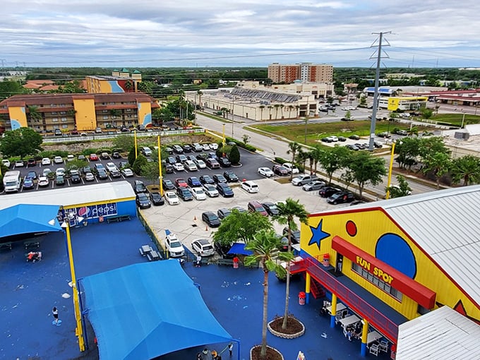 The bird's-eye view reveals Fun Spot's cheerful blue and yellow buildings—like a LEGO creation brought to life in the Florida sunshine.