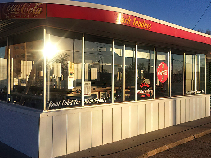 The iconic white building with red trim has been a Hutchinson landmark since 1948. The "Pork Tenders" sign promises nostalgic delights within.