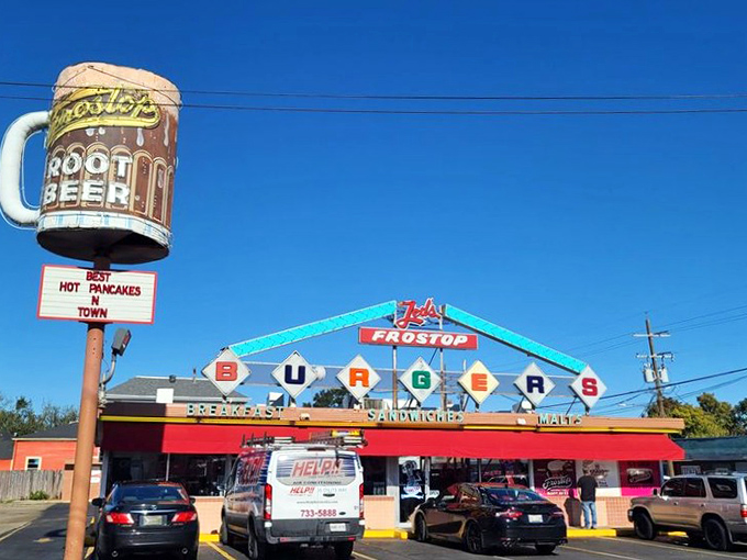That iconic blue and red Frostop sign isn't just a landmark—it's a promise of burger bliss waiting just beyond those doors.
