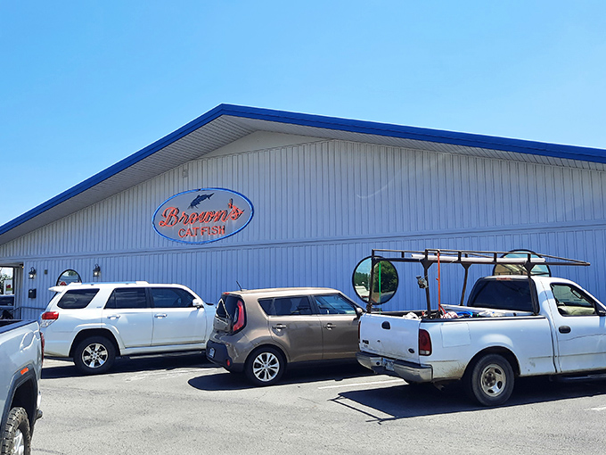 The bright blue exterior of Brown's Catfish isn't just a beacon for hungry travelers—it's practically a bat signal for anyone craving perfectly fried seafood in Russellville.