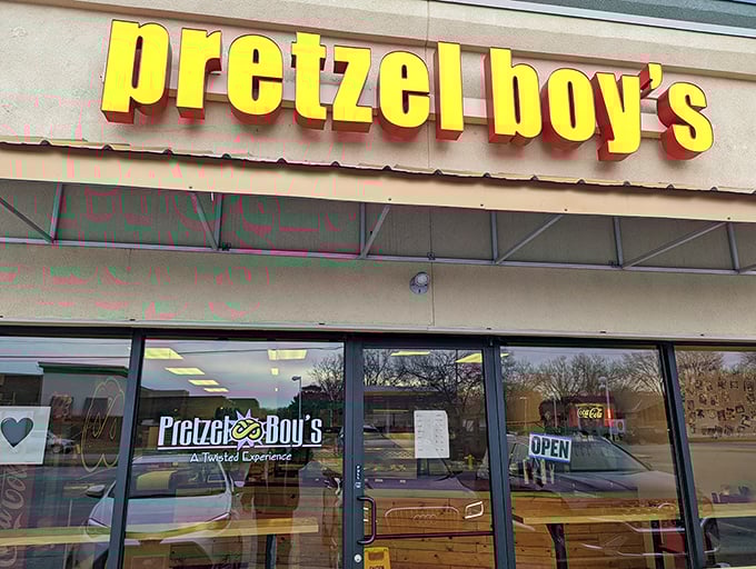 The bright yellow sign of Pretzel Boy's beckons like a carb-loving lighthouse, promising twisted delights within this Overland Park storefront.