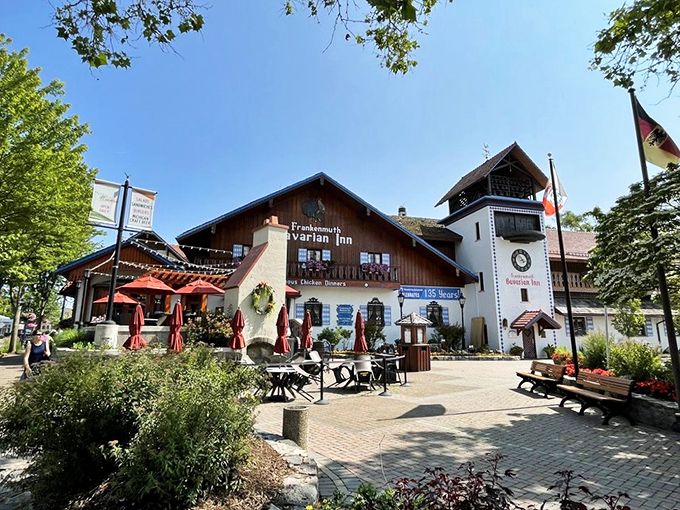 The Bavarian Inn stands like a postcard from Munich that somehow landed in Michigan, complete with clock tower and flower boxes that scream "Willkommen!"