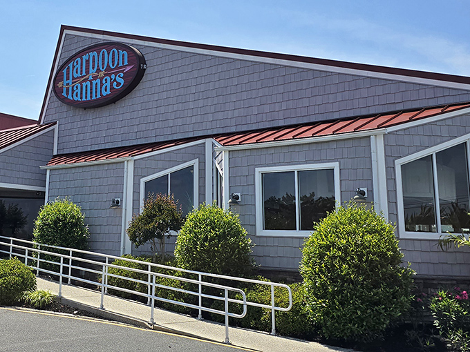 The classic blue sign beckons like a lighthouse for hungry travelers – promising delicious refuge from typical beach town fare.
