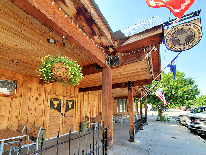 The rustic wooden exterior of The Hoof & Horn beckons like a frontier outpost for hungry travelers. Those swinging doors promise carnivorous delights within.