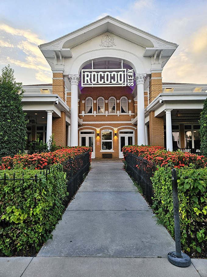 Grand doesn't begin to describe it. Rococo Steak's majestic exterior, with its illuminated columns and elegant façade, promises a dining experience worthy of royalty.