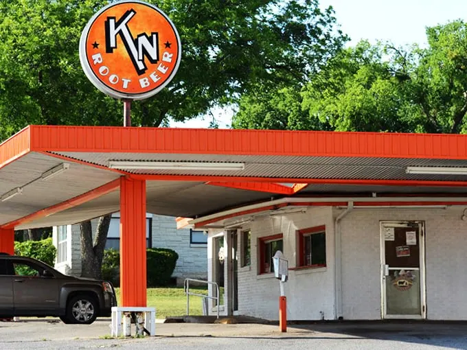 The unassuming exterior of K N Root Beer Drive In proves once again that Texas's greatest culinary treasures often hide in plain sight.