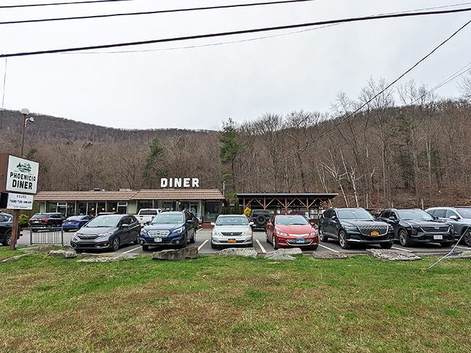 The unassuming roadside exterior belies culinary magic within. Those white "DINER" letters on the roof are like a beacon for hungry travelers in the Catskills.