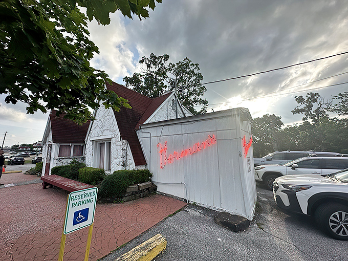 The unassuming white cottage exterior of Herman's Ribhouse is Arkansas's version of a culinary TARDIS – modest outside, magnificent within.