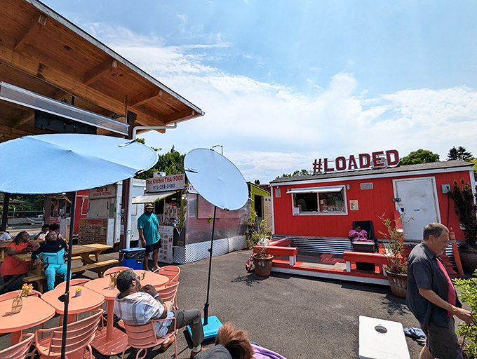 The bright red food cart with "#LOADED" emblazoned on top isn't just a name—it's a promise that's gloriously kept with every order.
