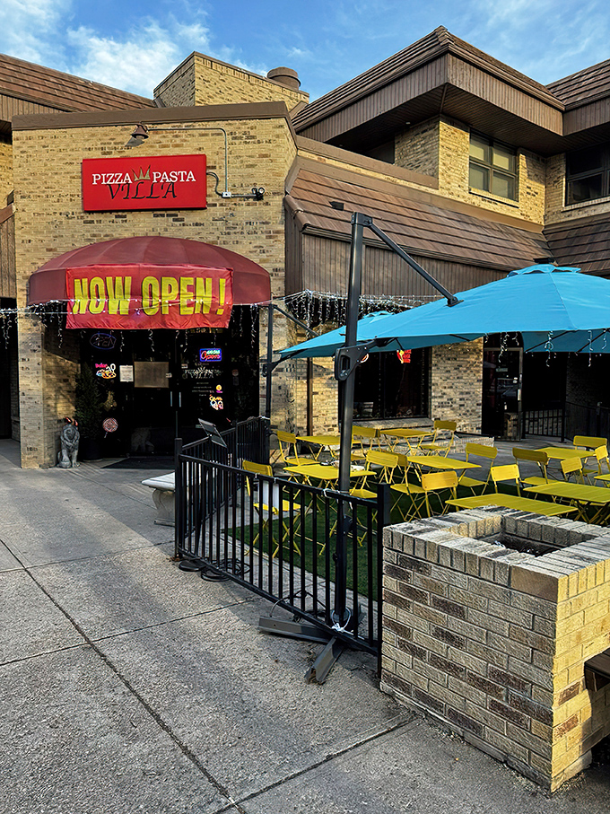The welcoming storefront of Pizza Pasta Villa announces itself without fanfare—just a simple red sign promising honest Italian comfort that delivers every time.
