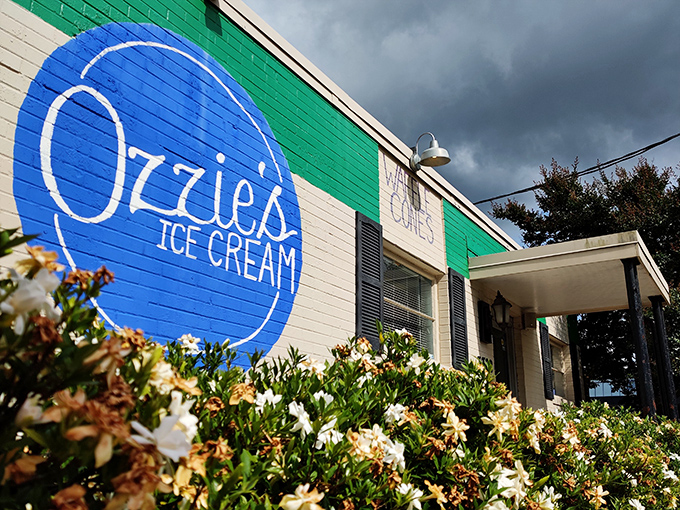 The brilliant blue sign of Ozzie's against white brick is like a beacon for ice cream lovers—simplicity that promises sweet perfection inside.