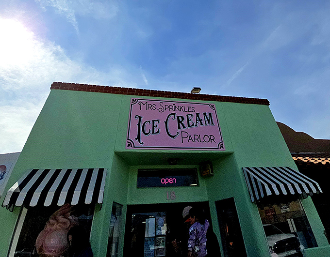 That mint-green facade with classic black and white awnings isn't just a building—it's a portal to simpler, sweeter times in Albuquerque.
