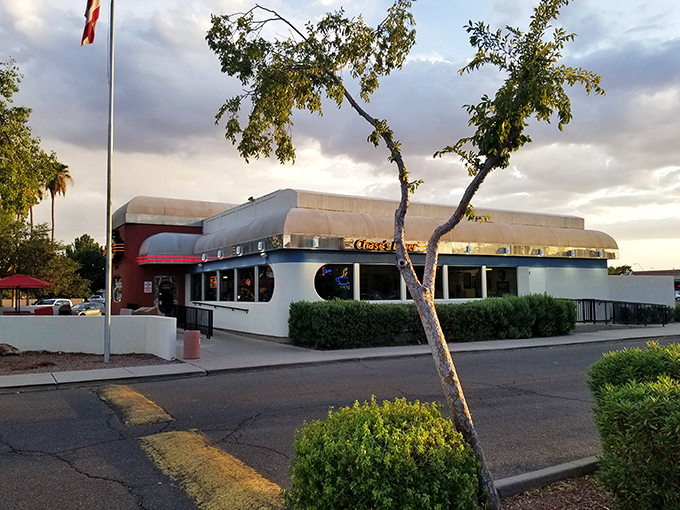 The red and white facade of Chase's Diner shines like a beacon against the Arizona sky, promising comfort food salvation to hungry travelers.