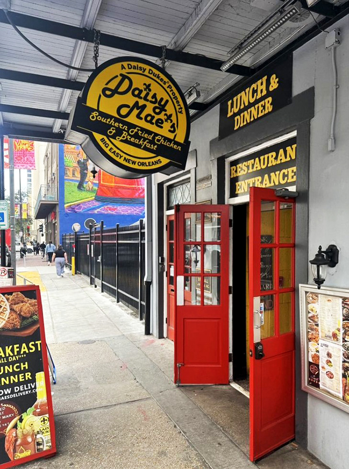 Those bright red doors aren't just an entrance—they're a portal to Southern breakfast nirvana in the heart of New Orleans.