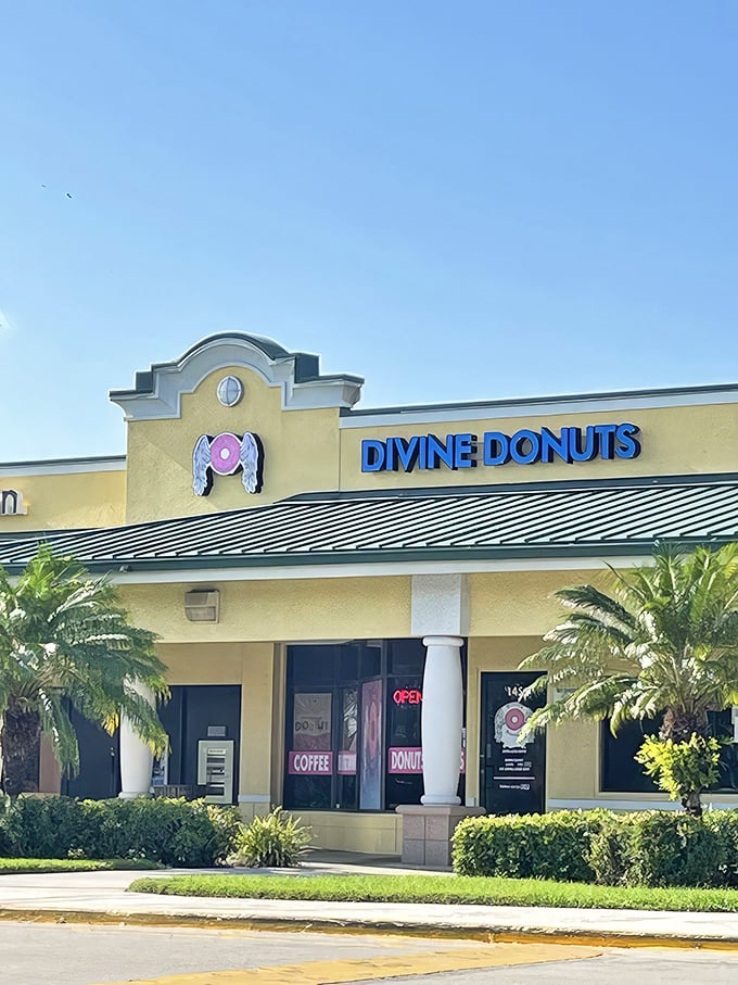 The sunshine-yellow exterior of Divine Donuts stands out like a beacon of hope for the sugar-deprived, complete with their angelic donut logo promising heavenly treats inside.