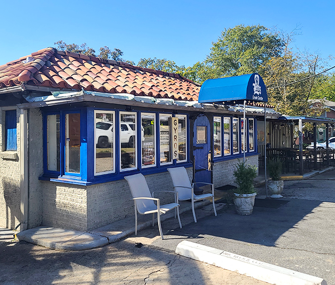 The blue-trimmed façade of Leo's Greek Castle stands like a Mediterranean mirage in Little Rock's Hillcrest neighborhood, promising authentic flavors behind its humble doors.