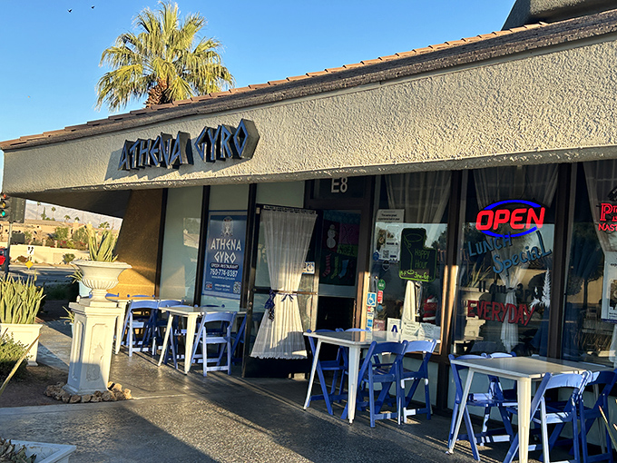 The blue glow of Athena Gyro's sign beckons like a Mediterranean lighthouse in the desert night, promising authentic Greek flavors behind those welcoming doors.