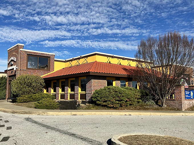 La Tolteca's sunny yellow exterior with terracotta roof stands like a beacon of culinary promise against Delaware's sky. No architectural awards here—just the promise of authentic flavors inside.