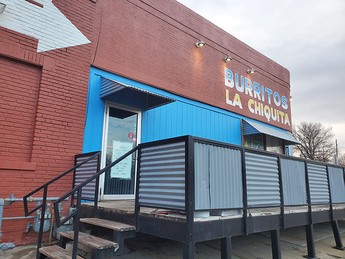 The bright blue entrance against brick-red walls isn't just eye-catching—it's a beacon for burrito lovers across Kansas City. No fancy frills, just fantastic food awaiting inside.