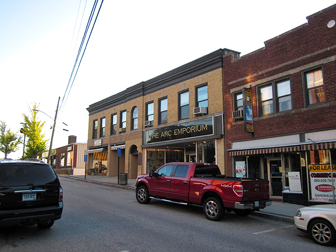Downtown Putnam at golden hour – where historic brick buildings and leafy trees create that perfect small-town tableau Norman Rockwell would've painted in a heartbeat.