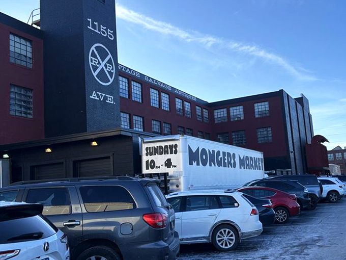 The iconic red brick and black smokestack of Mongers Market stands proudly on Railroad Avenue, a beacon for treasure hunters and nostalgia seekers.