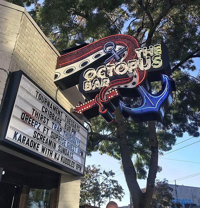 The white brick facade of The Octopus Bar might seem unassuming, but that blue cephalopod sign promises an evening of maritime mischief awaits inside.