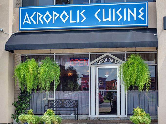 The bright blue sign of Acropolis Greek Cafe stands out like a Mediterranean beacon in New Orleans, promising authentic Greek flavors just steps away.