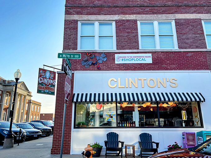 The classic storefront beckons with its vintage charm—Clinton's iconic awning and cozy outdoor seating invite you to step back in time on Independence Square.