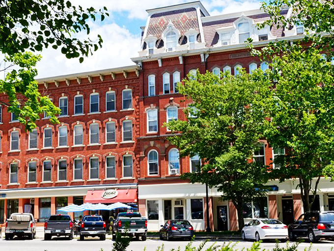 Downtown Keene's colorful storefronts welcome visitors with New England charm. Those awnings aren't just pretty—they're perfect for window shopping in any weather.