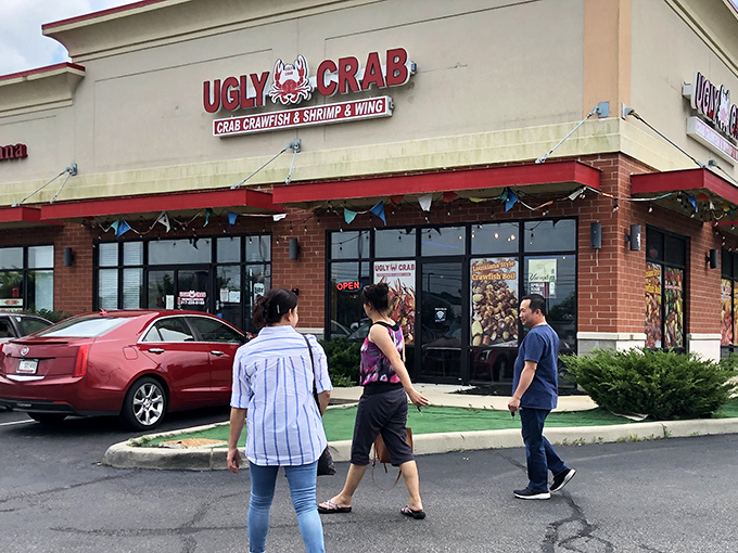 The unassuming storefront of Ugly Crab boldly announces its seafood mission – where flavor trumps vanity and Hoosiers find coastal treasures.
