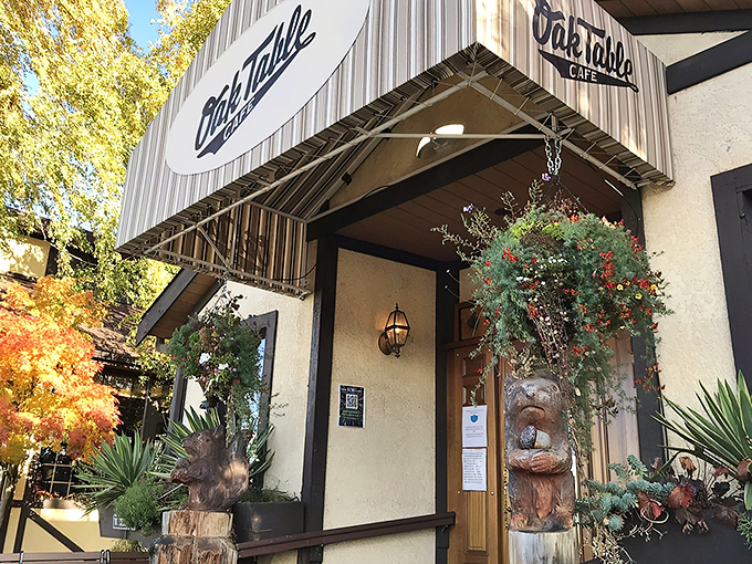 The timber-framed facade of Oak Table Cafe welcomes you like a breakfast hug. Those hanging flower baskets aren't just pretty—they're signaling that good taste awaits inside.