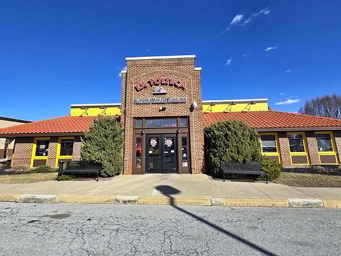 La Tolteca's sunny yellow exterior with terracotta roof stands like a beacon of culinary promise against Delaware's sky. No architectural awards here—just the promise of authentic flavors inside.