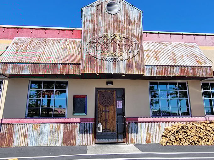 That neon pig sign isn't just decoration—it's a beacon of hope for the barbecue-deprived, glowing like a meaty North Star in Boulder City's night sky.