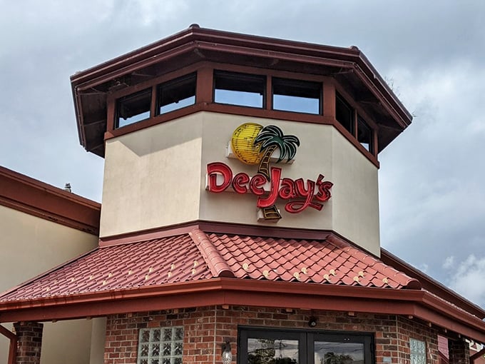 That iconic tower with its sunny yellow logo and palm tree is like a lighthouse for hungry souls—guiding barbecue pilgrims home through the West Virginia hills.