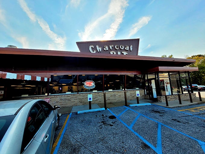 The mid-century charm of Charcoal Pit stands proudly on Concord Pike, its distinctive angular roof beckoning burger lovers like a meaty lighthouse on Delaware's culinary shore.