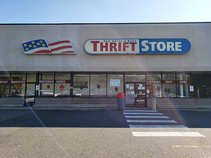 The patriotic facade of Red White & Blue Thrift Store stands proudly against a blue Connecticut sky, like a bargain-hunter's version of the Promised Land. 