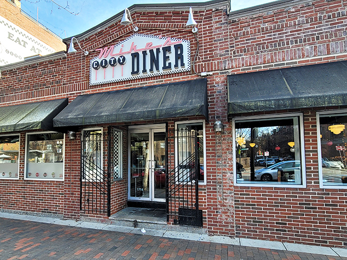 The brick façade of Mike's City Diner stands like a beacon of breakfast hope on Washington Street, promising culinary salvation to hungry Bostonians.